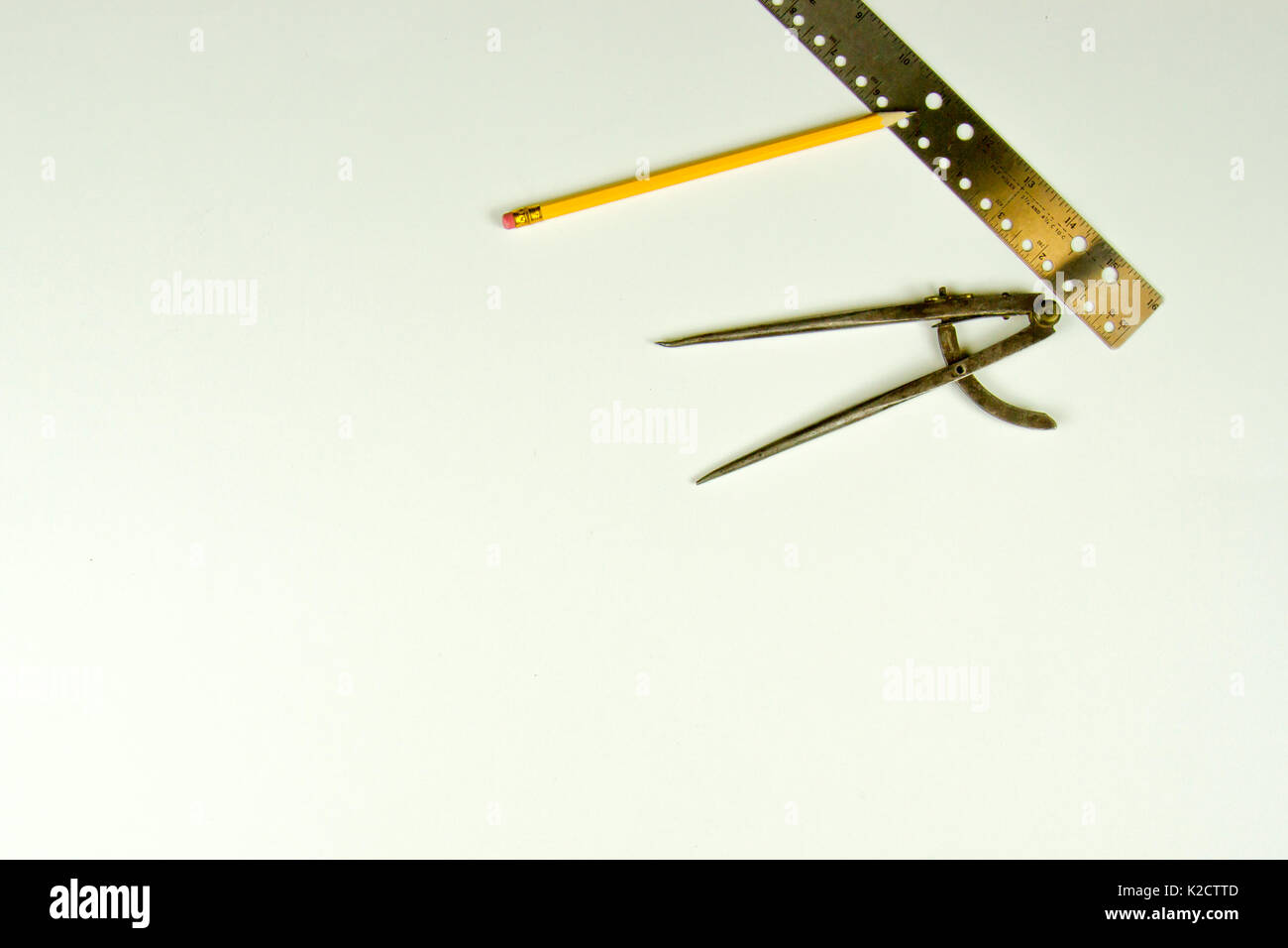 Metal protractor, ruler and pencil on white background with copy space ...