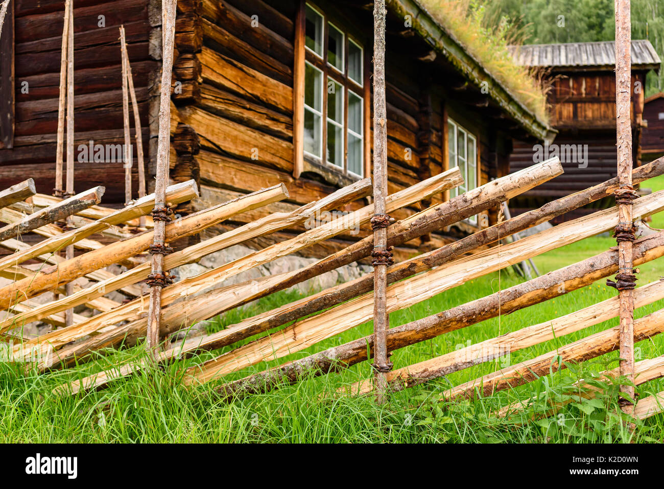Traditional Scandinavian wooden round pole fence with wooden timbered ...