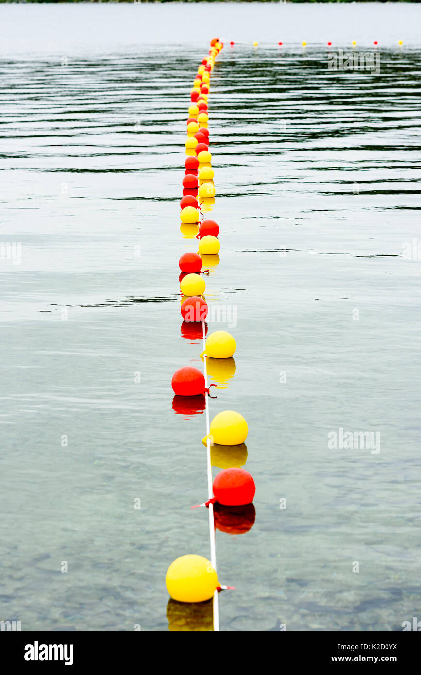 Row of safety buoys along a rope in the water at a reservoir Stock ...