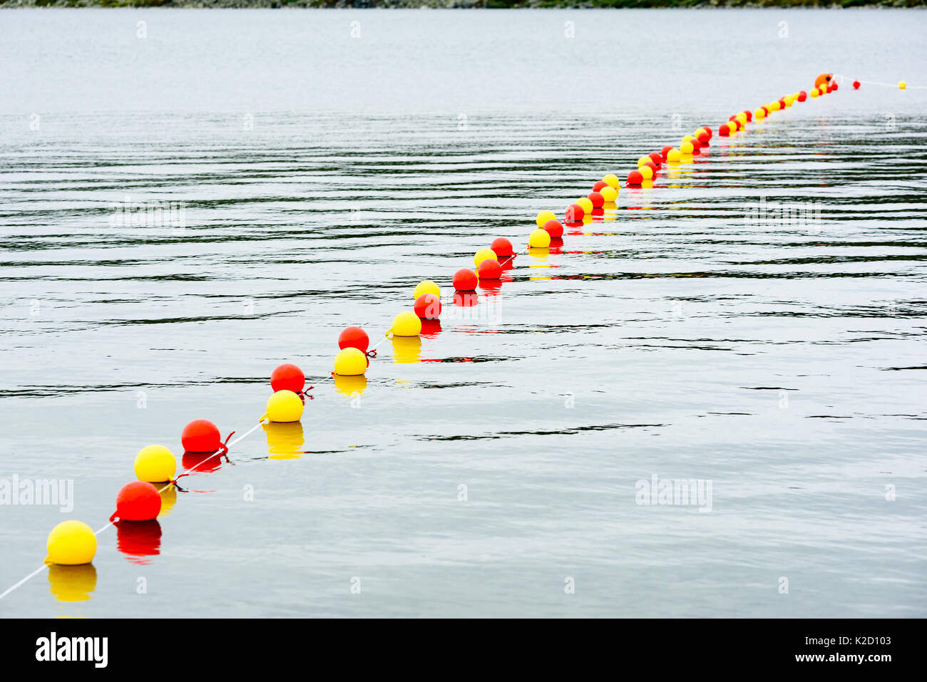 Row of safety buoys along a rope in the water at a reservoir Stock ...