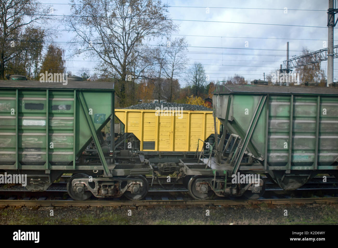 rail transportation of different goods. cars of train in summer Stock ...