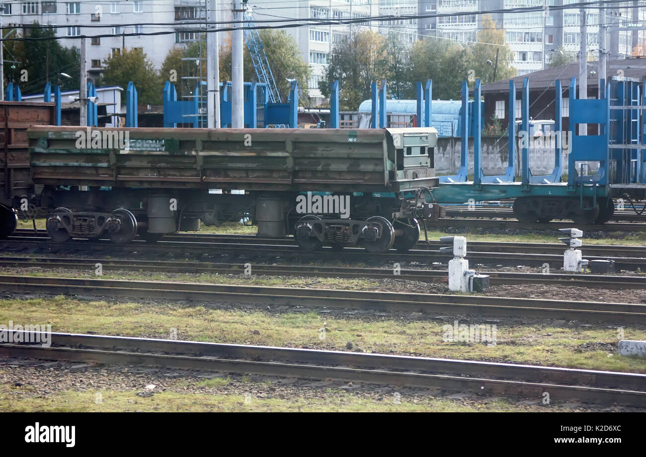 rail transportation of different goods. cars of train in summer Stock ...