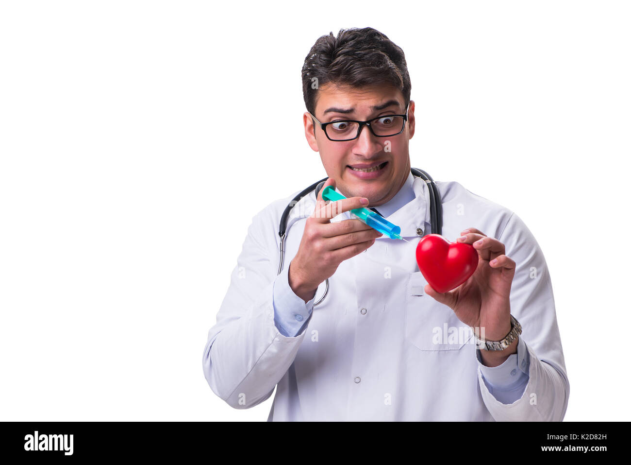 Young male cardiologist doctor holding a heart isolated on white ...