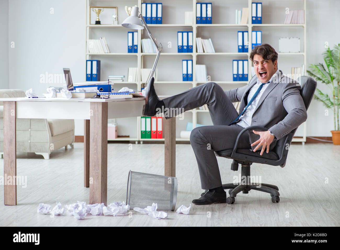 Angry businessman shocked working in the office fired sacked Stock ...