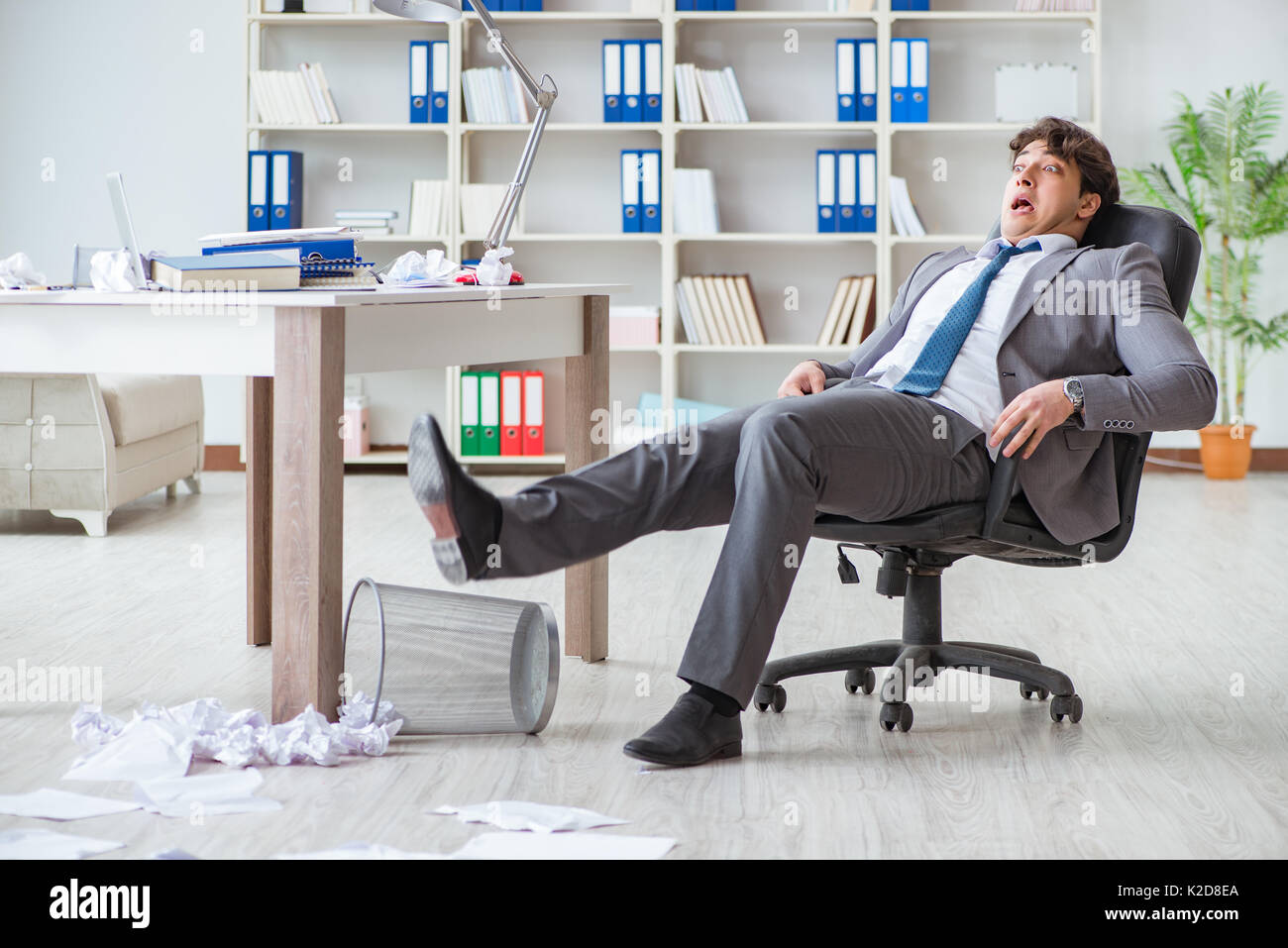 Businessman having fun taking a break in the office at work Stock Photo ...