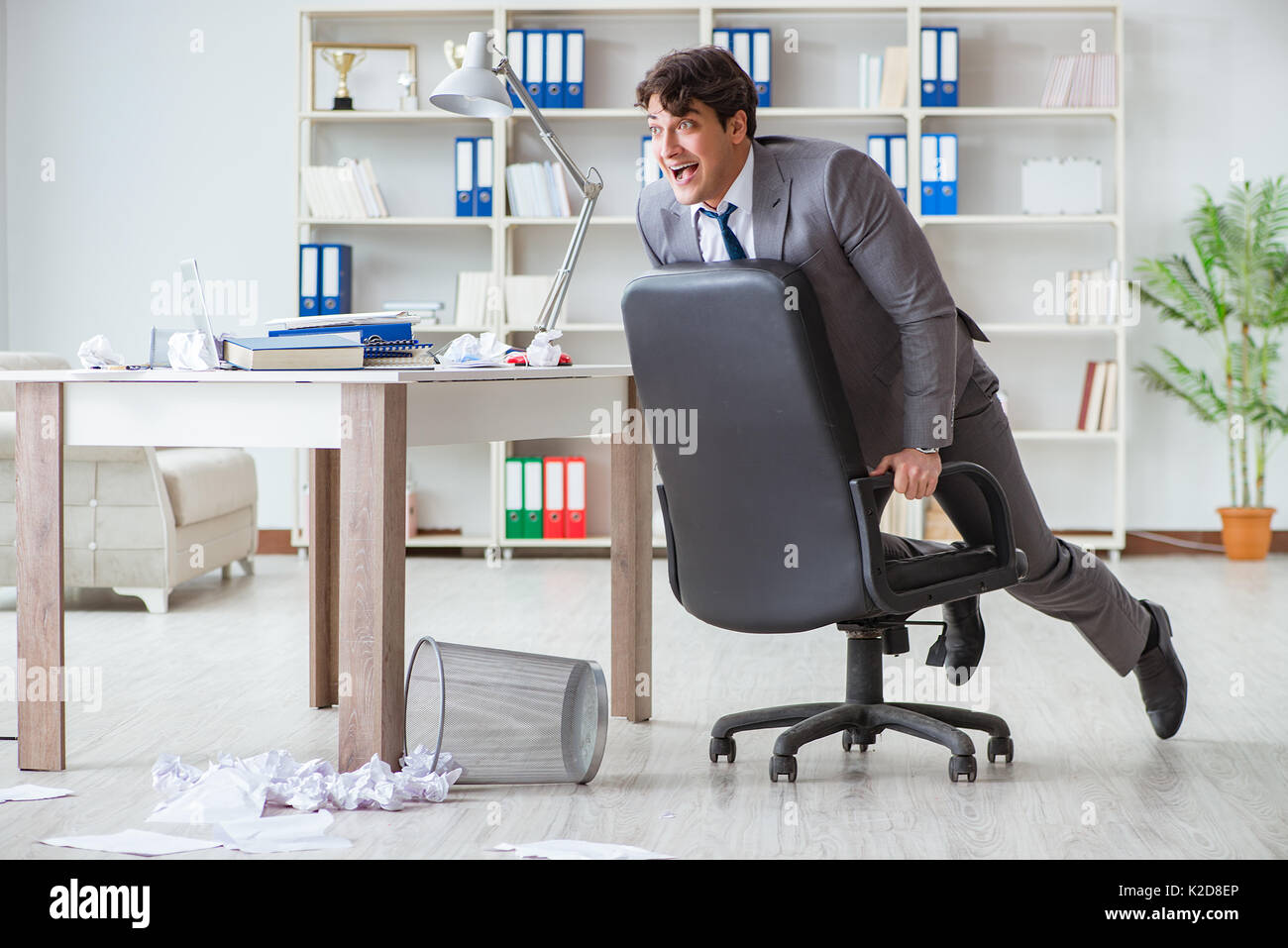 Businessman having fun taking a break in the office at work Stock Photo ...