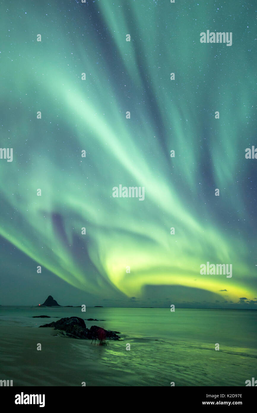 Northern lights showing above beach close to Bleiksoya bird island near ...