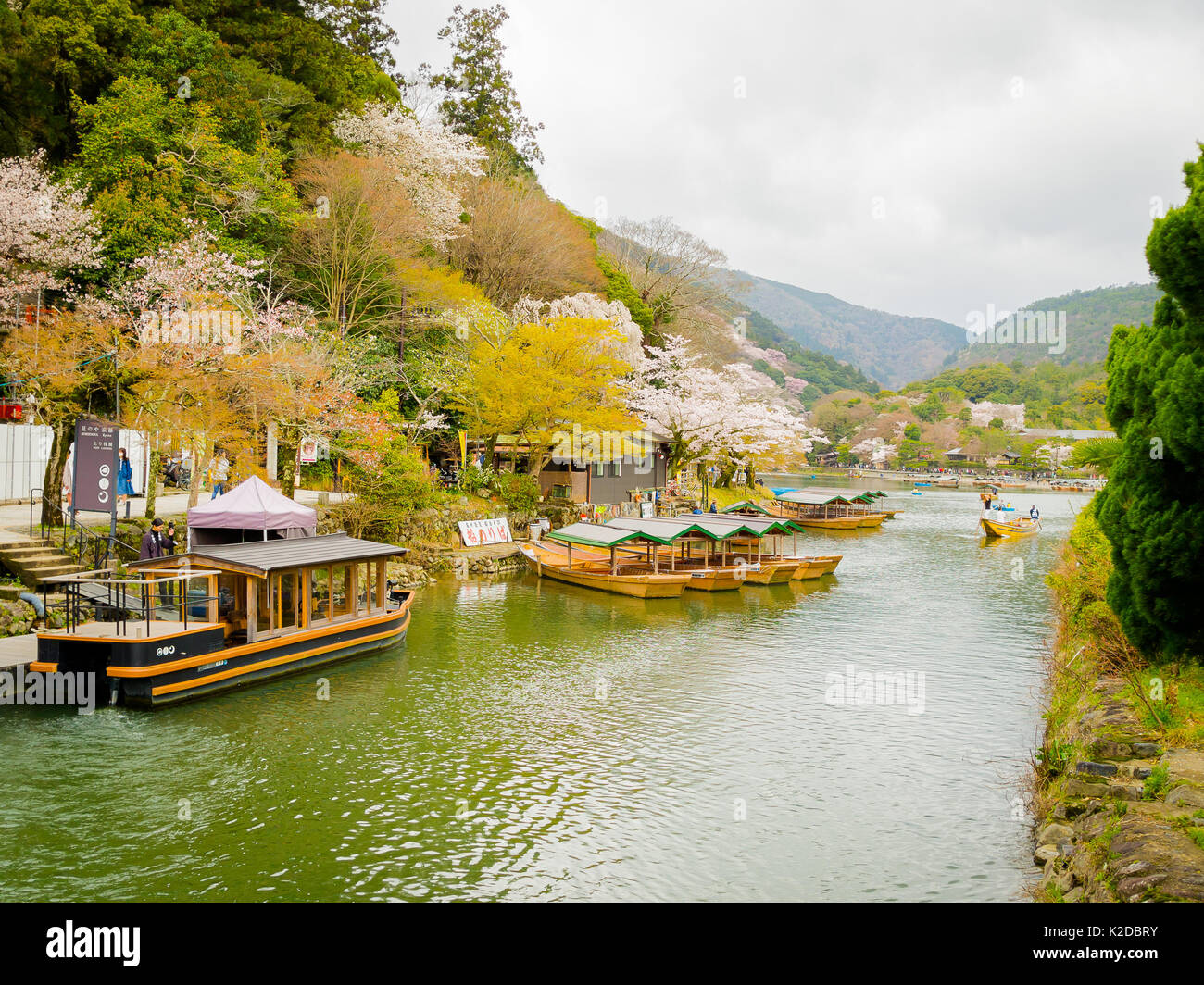 HAKONE, JAPAN - JULY 02, 2017: Tourists rowing boats on a lake under ...