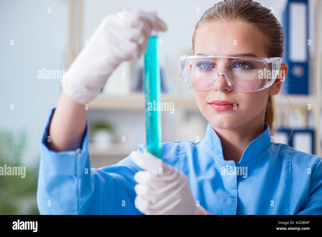Female scientist researcher conducting an experiment in a laboratory ...