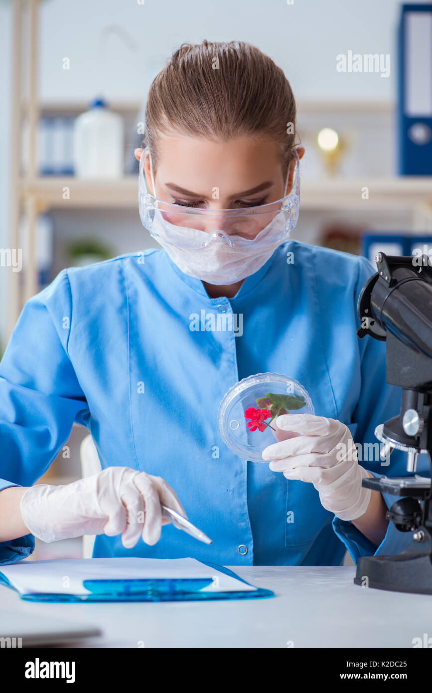 Female scientist researcher conducting an experiment in a laboratory ...