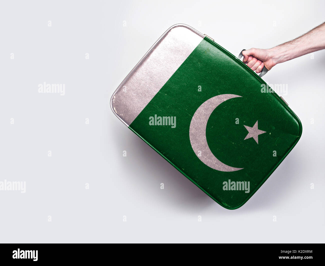 Pakistan flag on a vintage leather suitcase Stock Photo - Alamy