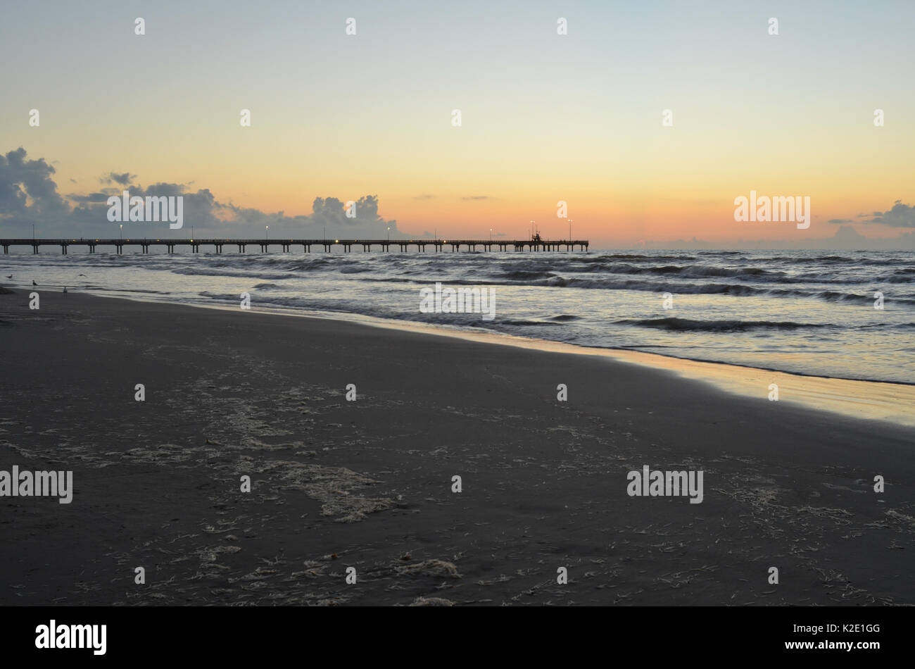 night into morning on Padre Island beach near lighted pier Corpus ...