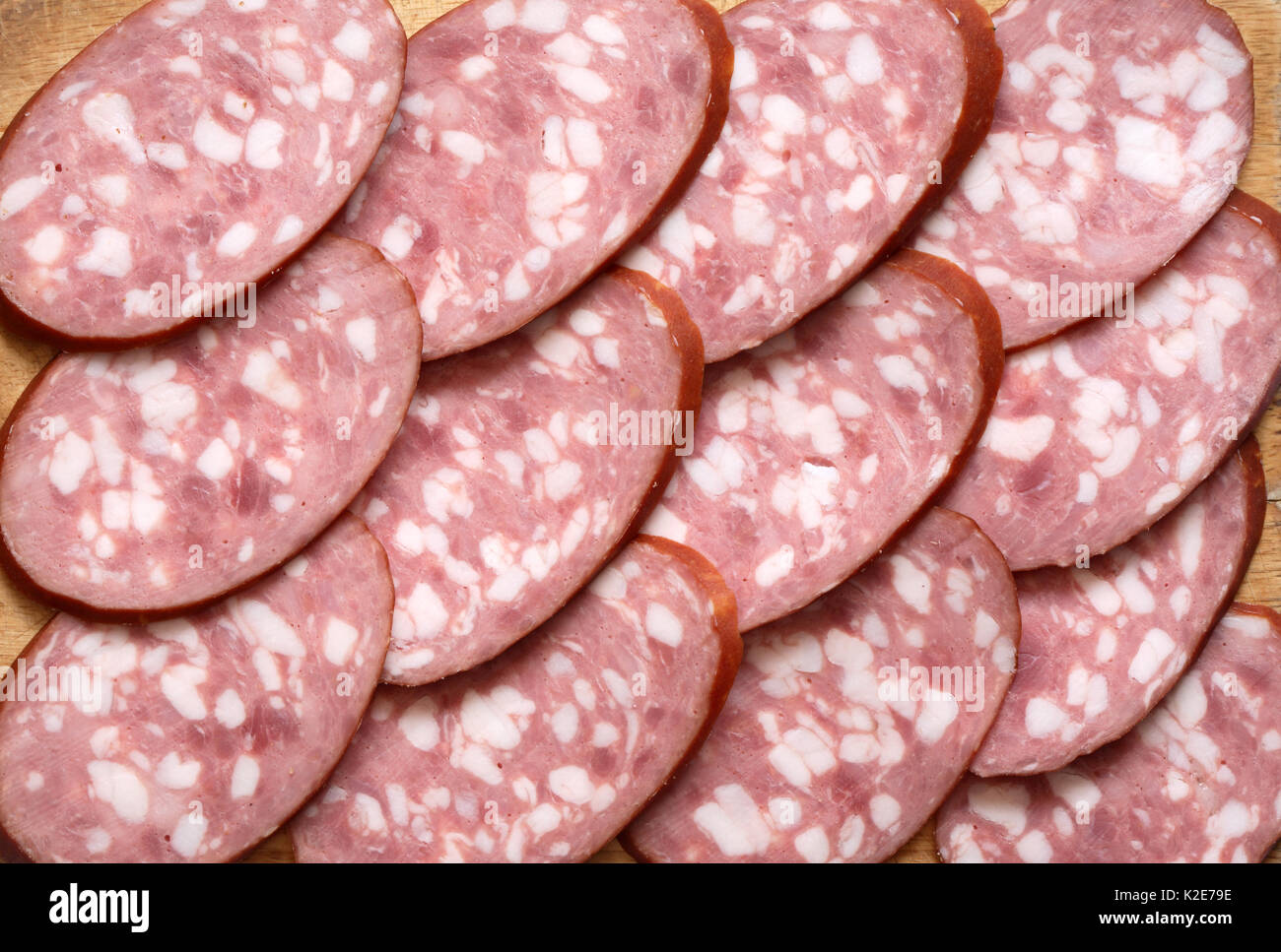 Background made from lot of sliced salami. Extreme closeup Stock Photo ...