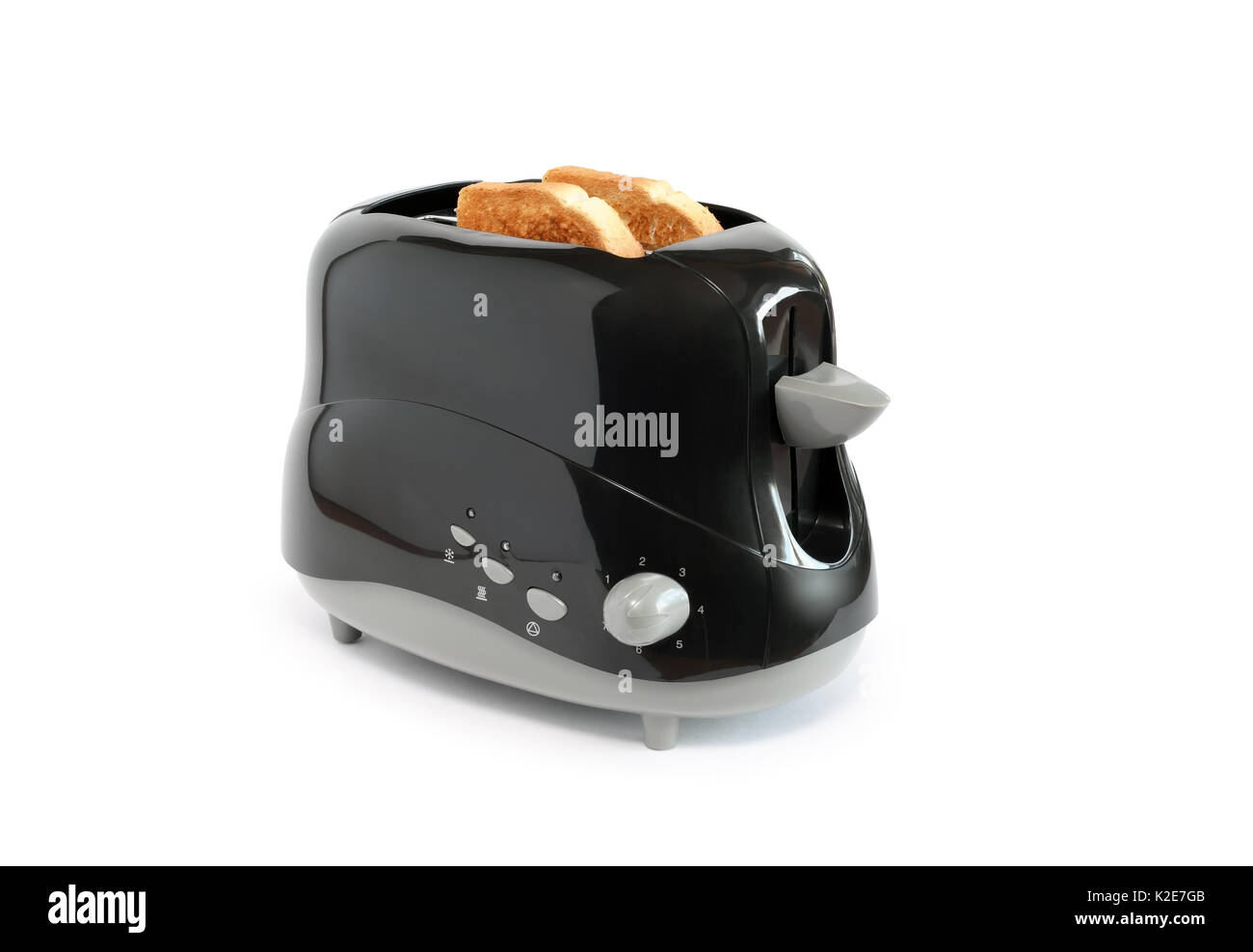 Two toasts inside black toaster on white background. Isolated with ...