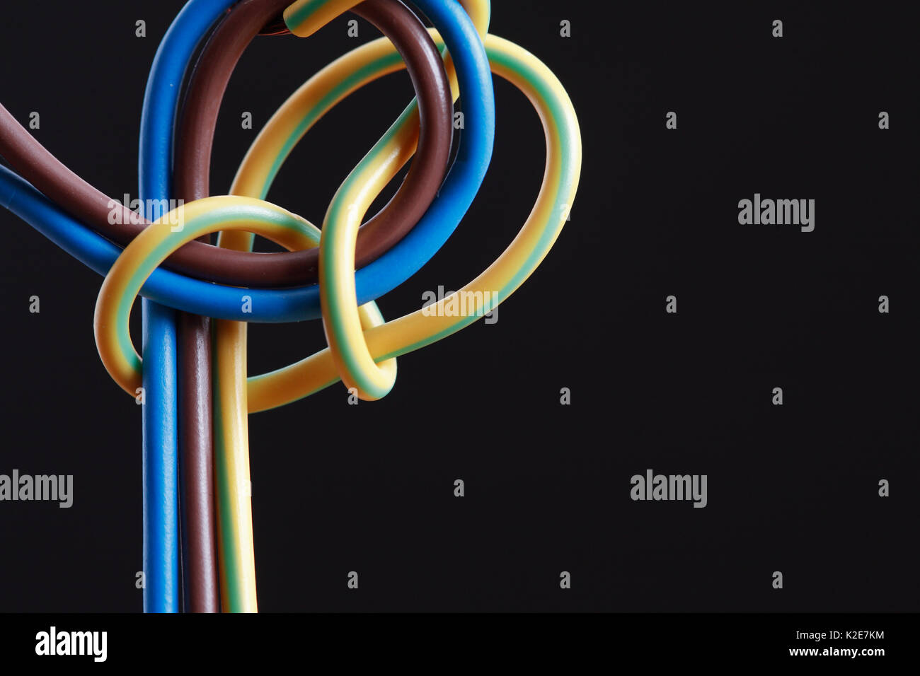 Abstract composition with knotted colored wire on dark background Stock ...