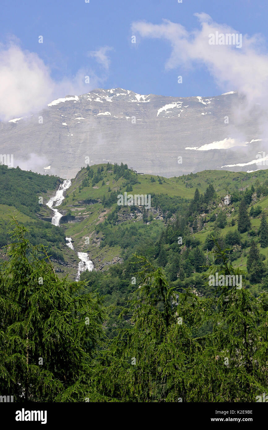 Towering mountain and waterfall in the Hohe Tauern National Park ...