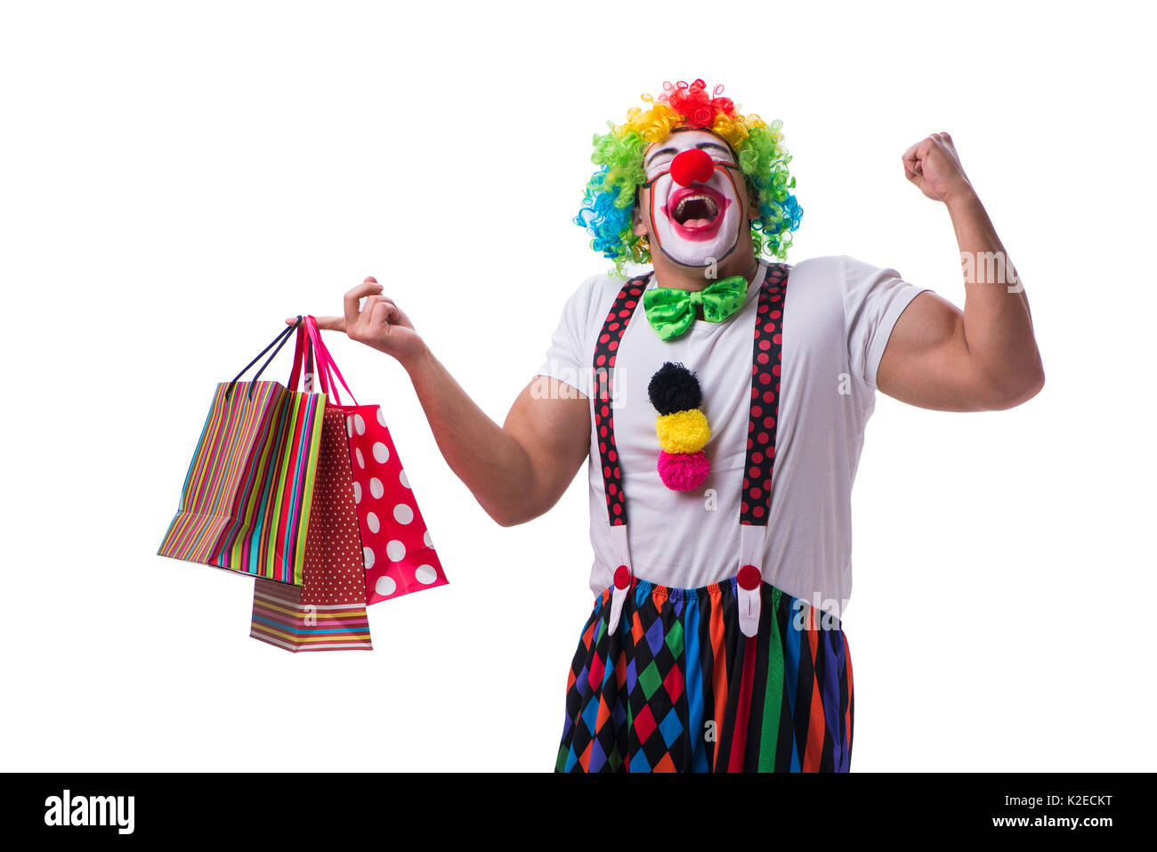 Funny clown with shopping bags isolated on white background Stock Photo ...