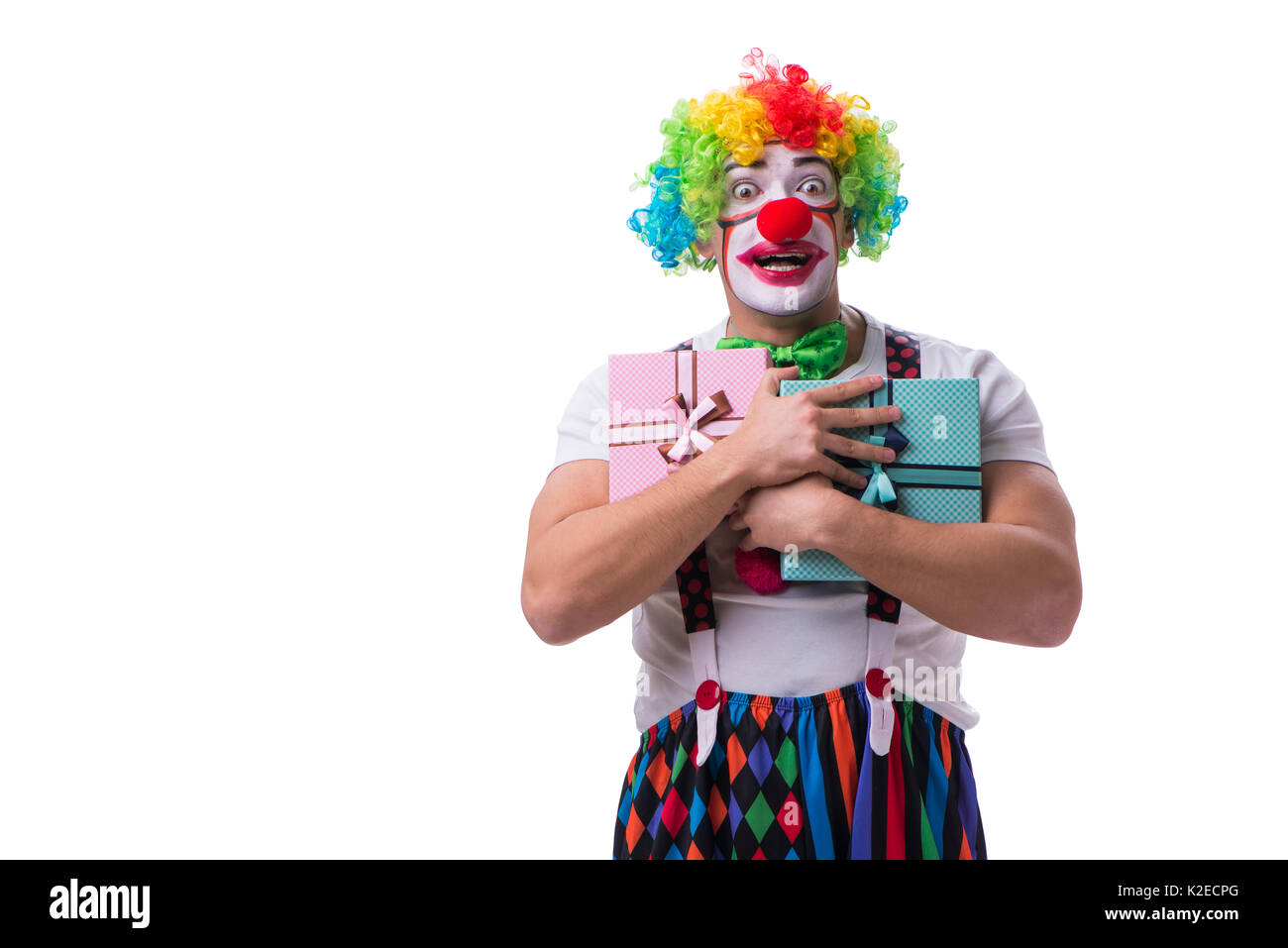 Funny clown with a gift present box isolated on white background Stock ...