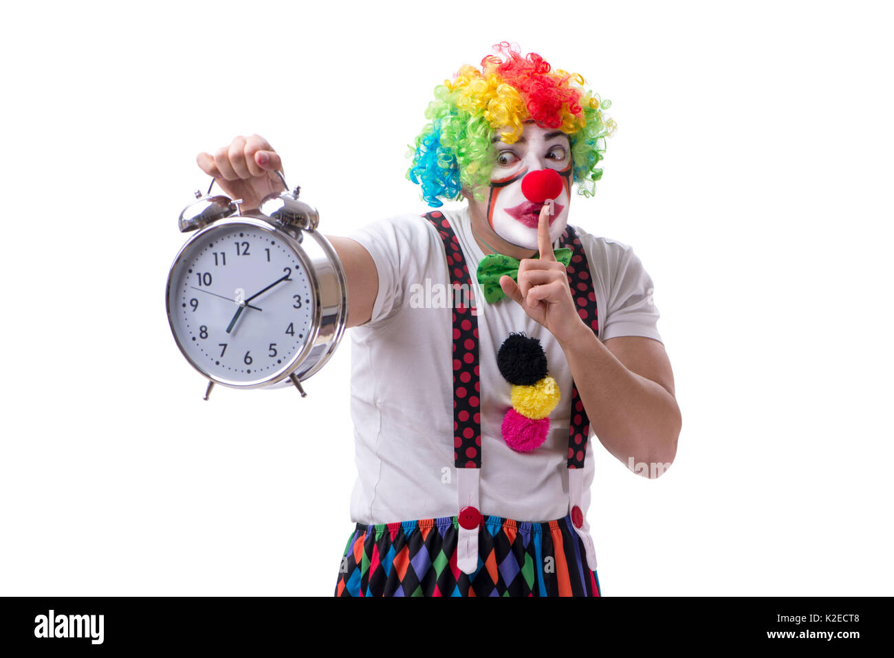 Funny clown with an alarm clock isolated on white background Stock ...