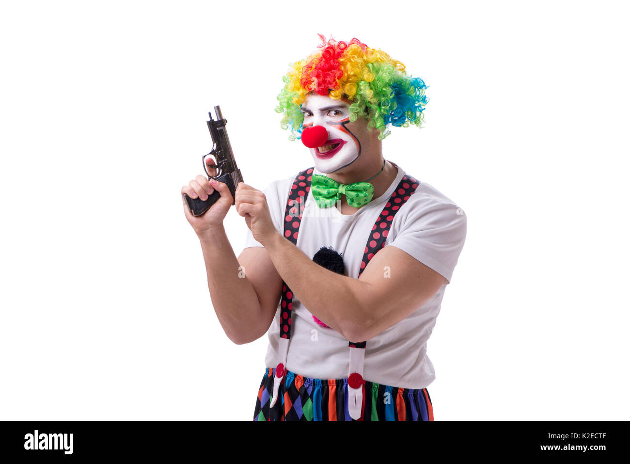 Funny clown with a gun pistol isolated on white background Stock Photo ...