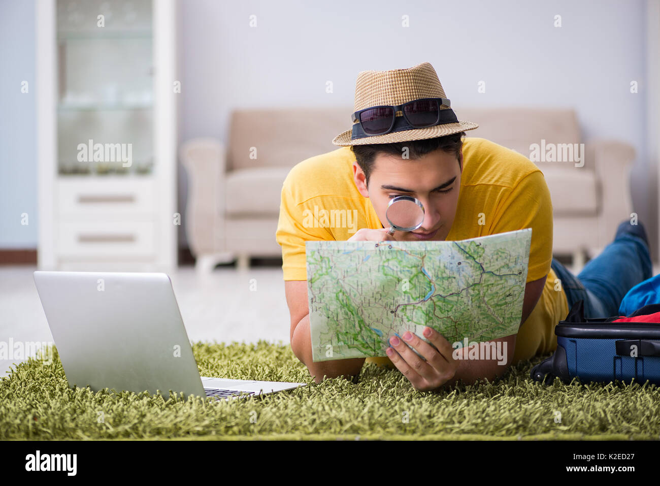 Man planning his vacation trip with map Stock Photo - Alamy