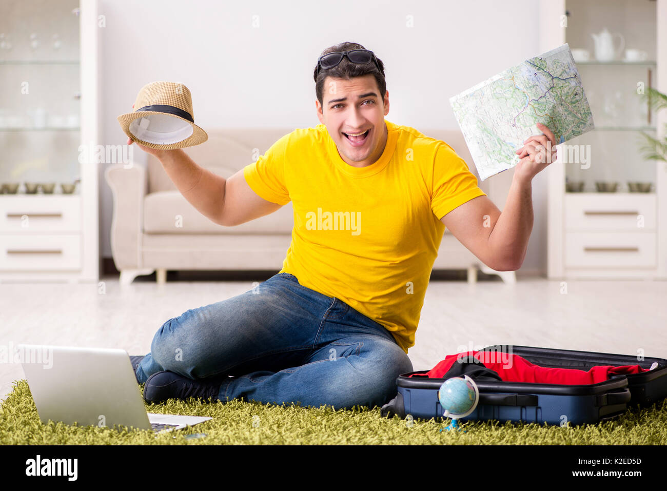 Man planning his vacation trip with map Stock Photo - Alamy
