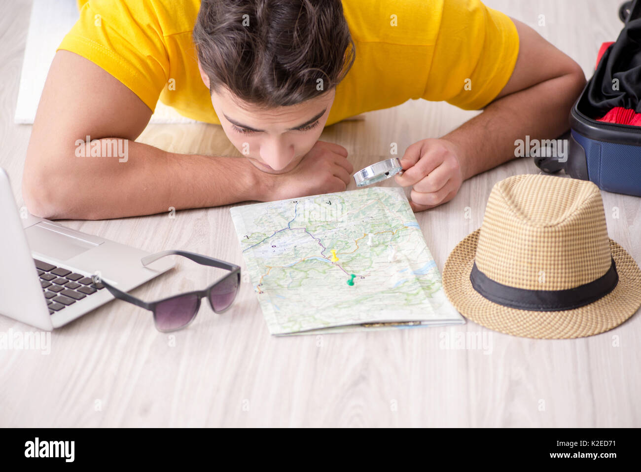 Man planning his vacation trip with map Stock Photo - Alamy