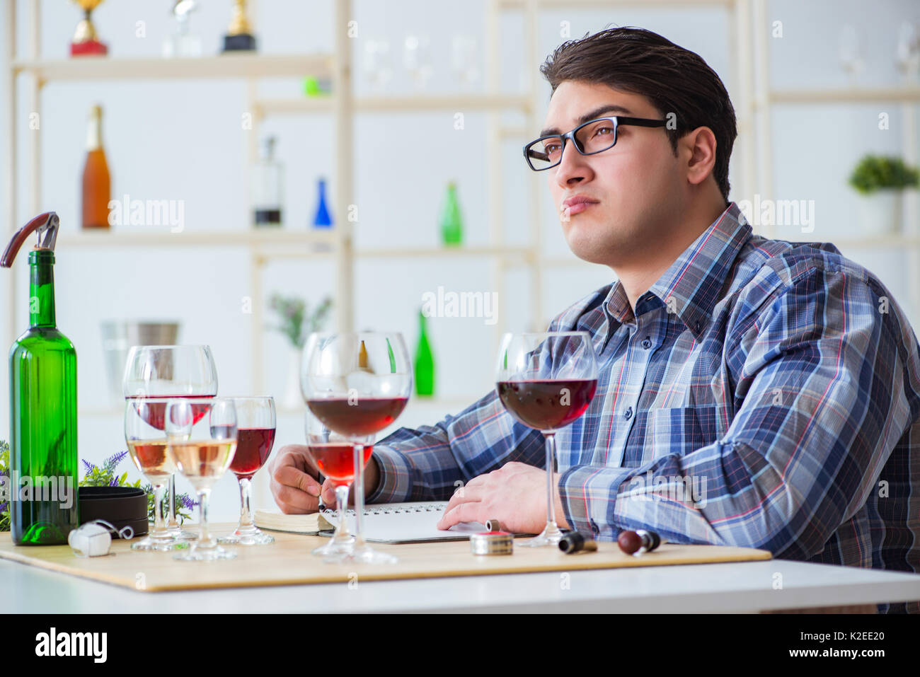 Professional sommelier tasting red wine Stock Photo - Alamy