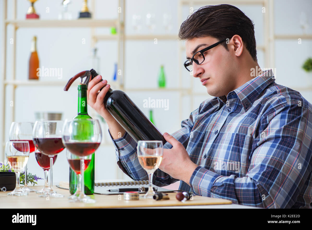 Professional sommelier tasting red wine Stock Photo - Alamy