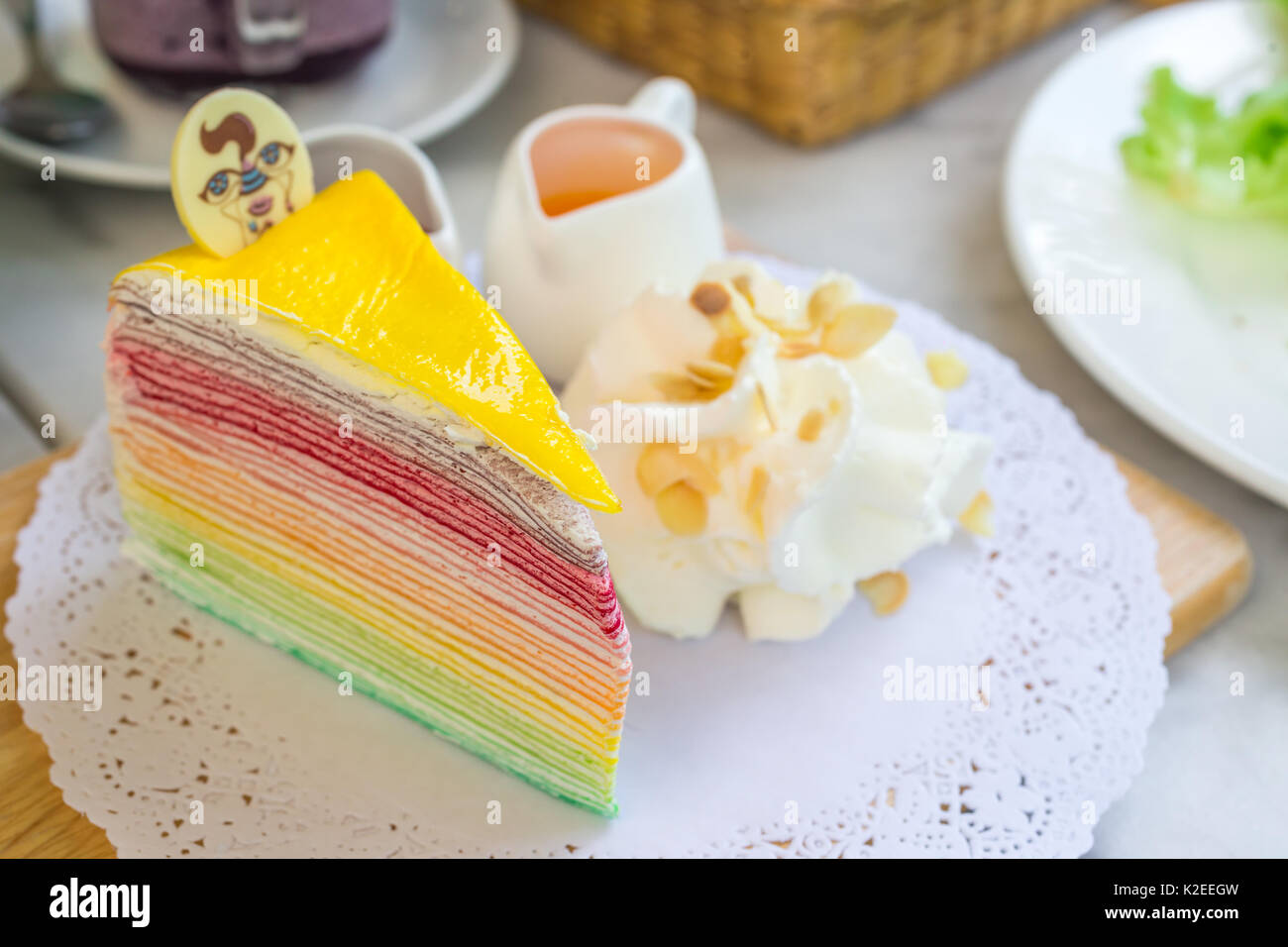 rainbow crape cake with raspberry jam or strawberry jam Stock Photo - Alamy