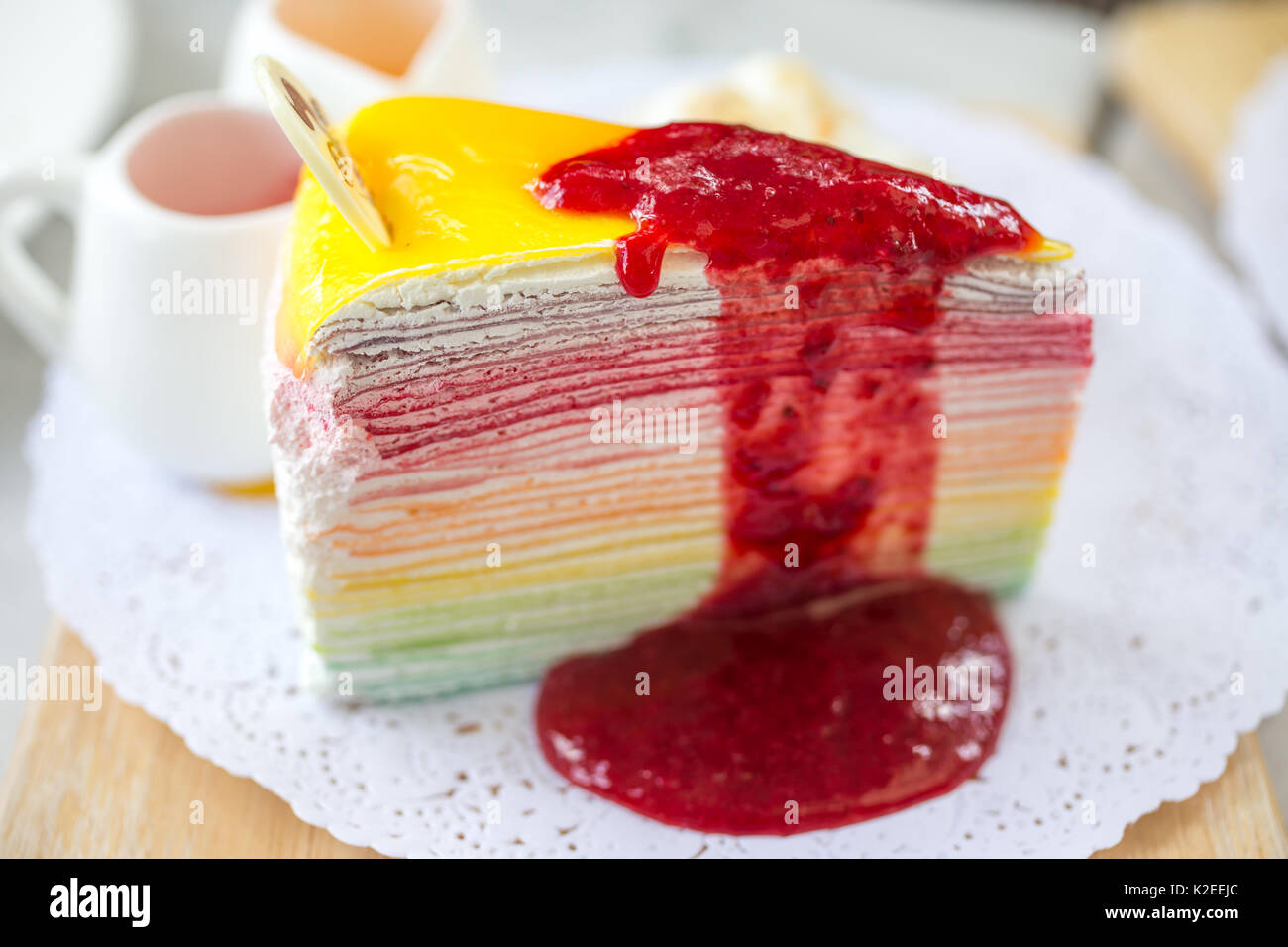 rainbow crape cake with raspberry jam or strawberry jam Stock Photo - Alamy