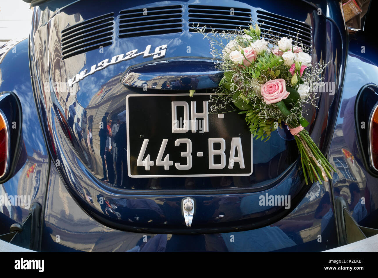 Old Volkswagen Beatle car decorated with bouquet of flowers for a ...