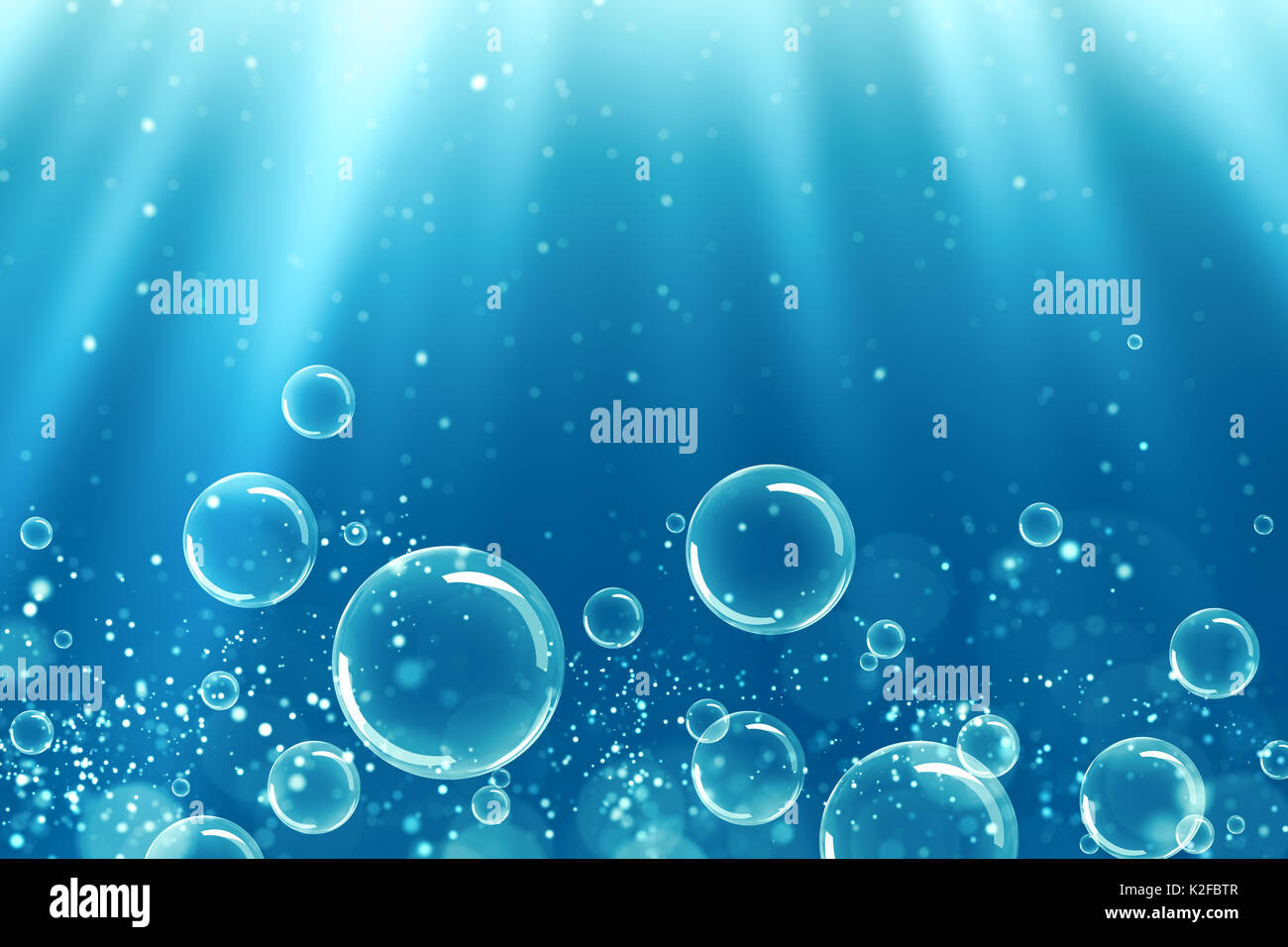 Bubbles in the water illuminated by rays of light Stock Photo - Alamy