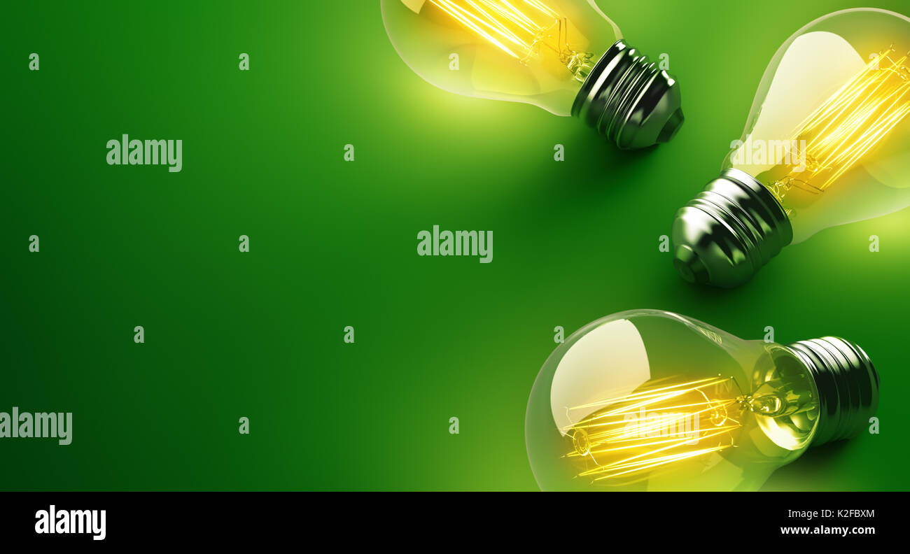 Glowing light bulb on green background Stock Photo - Alamy