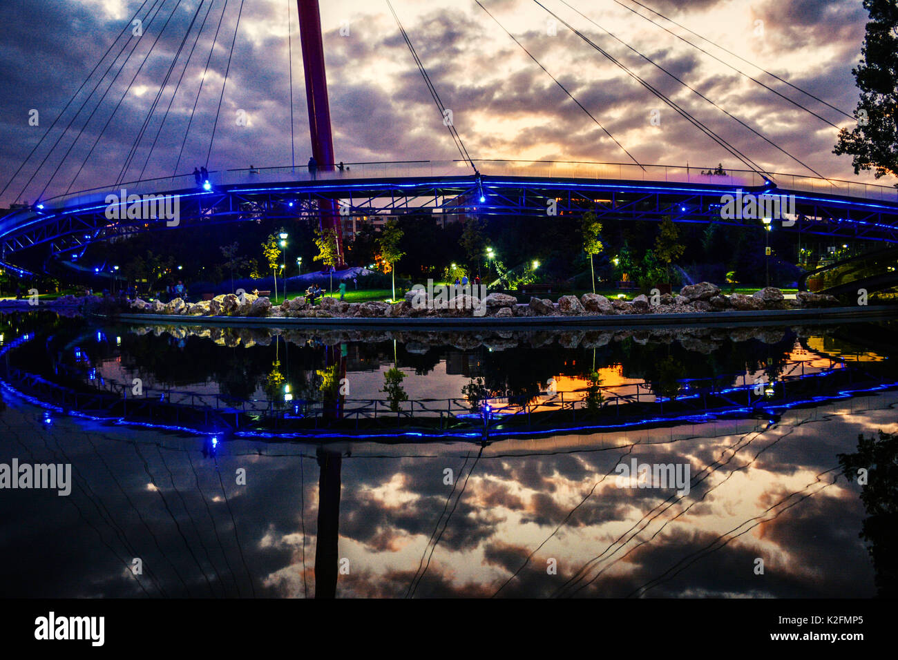 The futuristic bridge from the renovated park Moghioros, at sunset, in ...