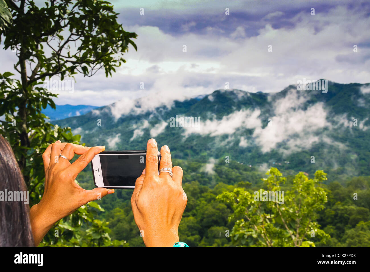 Hands Of Tourists Take A Photos Misty Over The Mountains Landscape In ...