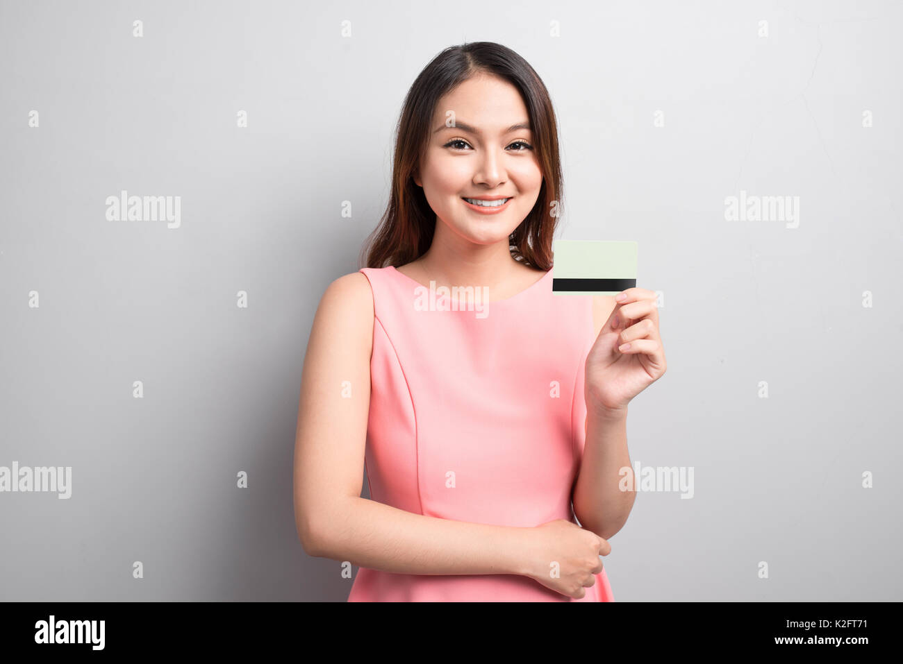 Charming asian woman hand show credit card. Presenting your product ...