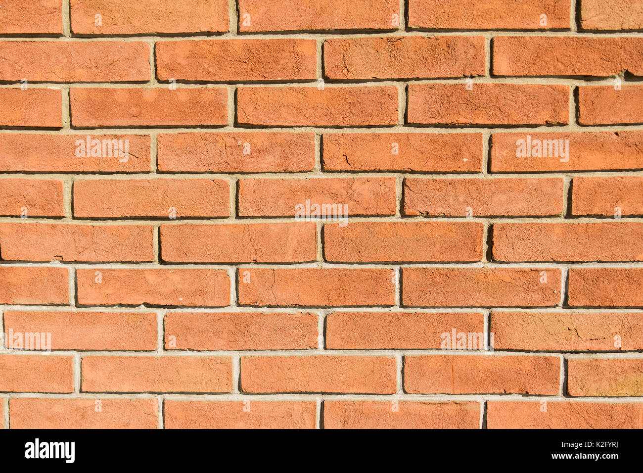 real orange red brick wall masonry background Stock Photo - Alamy