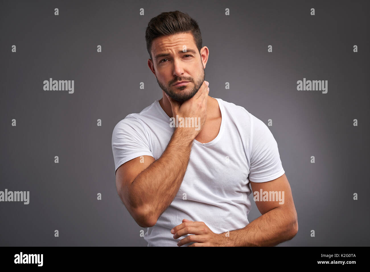 A handsome young man checking the skin on his face Stock Photo - Alamy