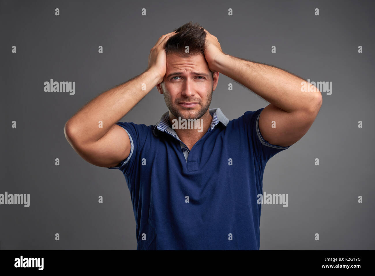 A handsome young man feeling sad and desperate Stock Photo - Alamy