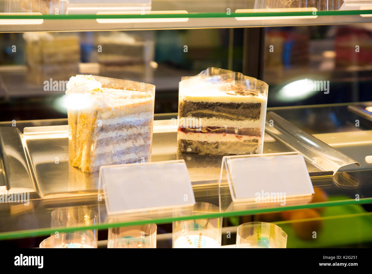 Cakes in a display cabinet hi-res stock photography and images - Alamy