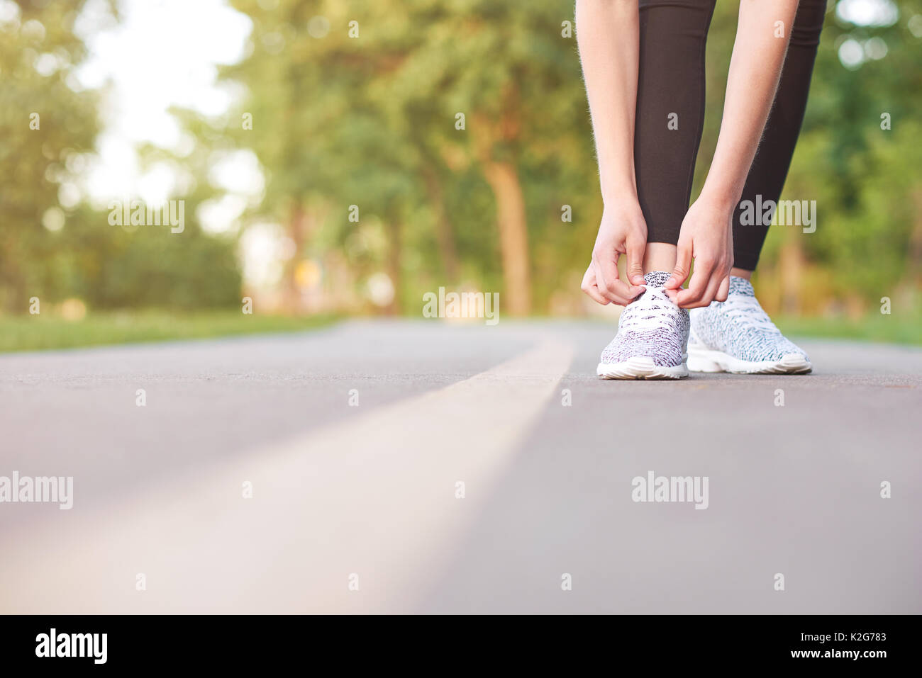 Female runner jogging in the forest Stock Photo - Alamy