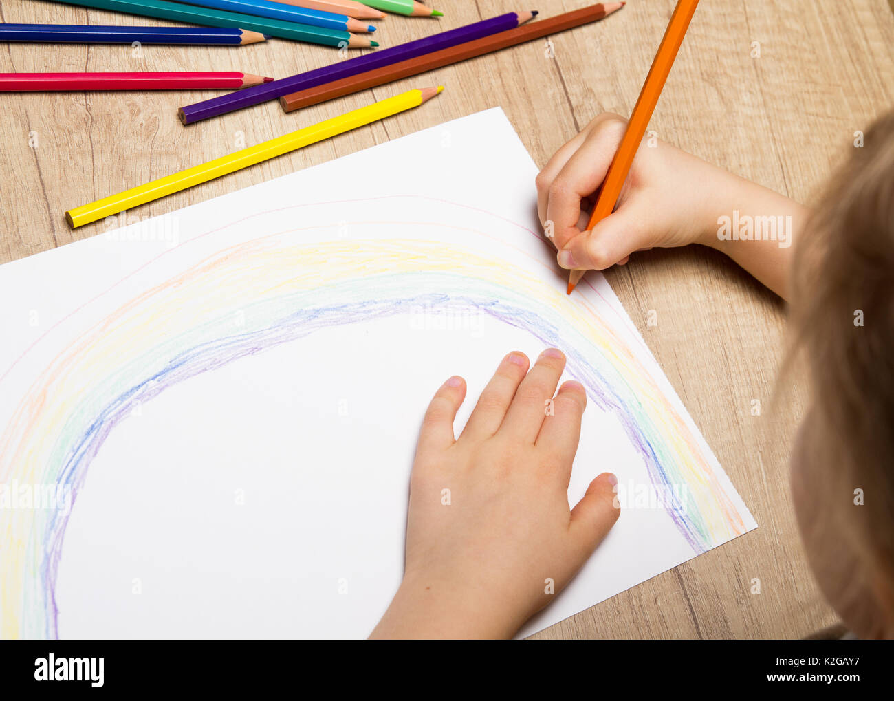 Hand of child drawing by colour pencil Stock Photo - Alamy