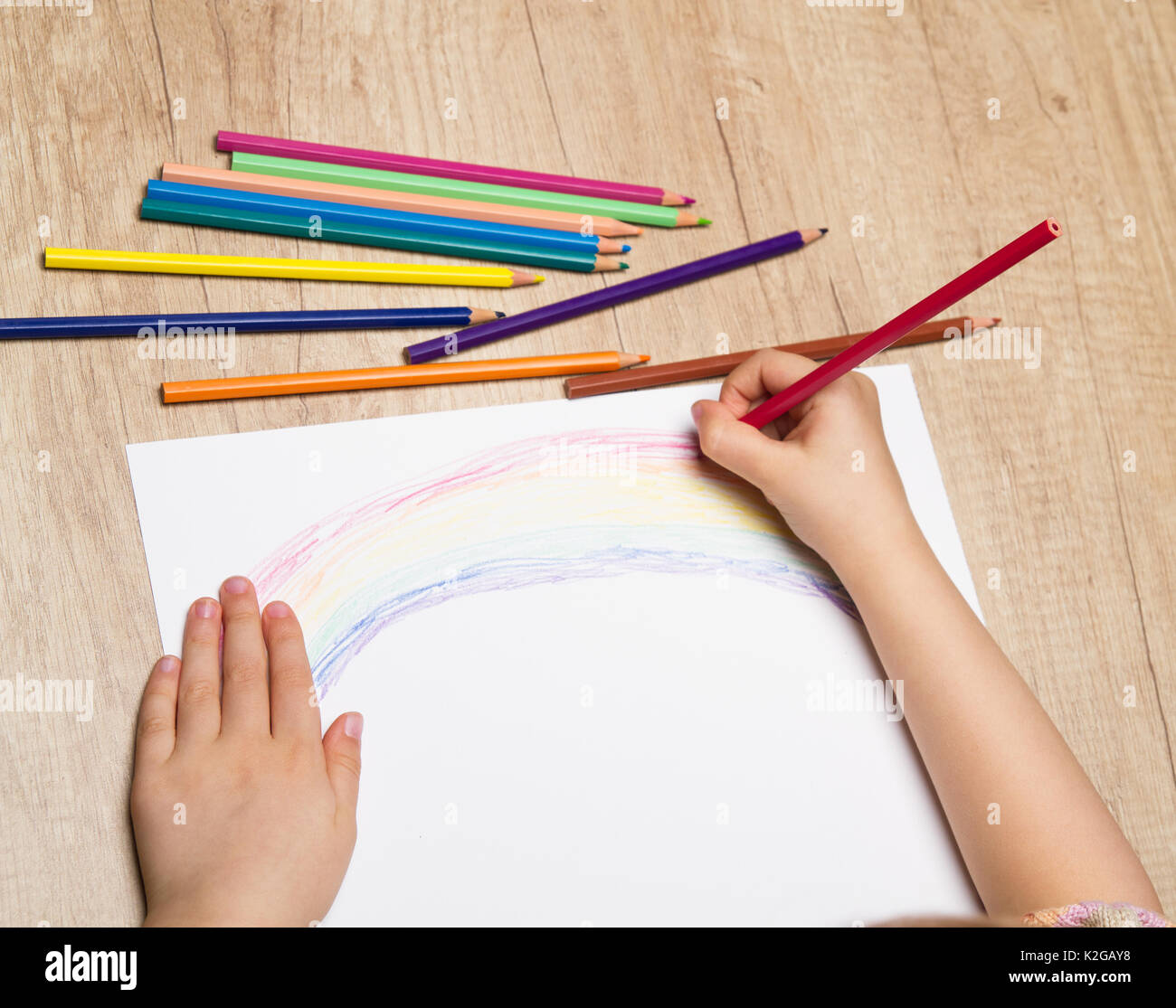 Hand of child drawing by colour pencil Stock Photo - Alamy