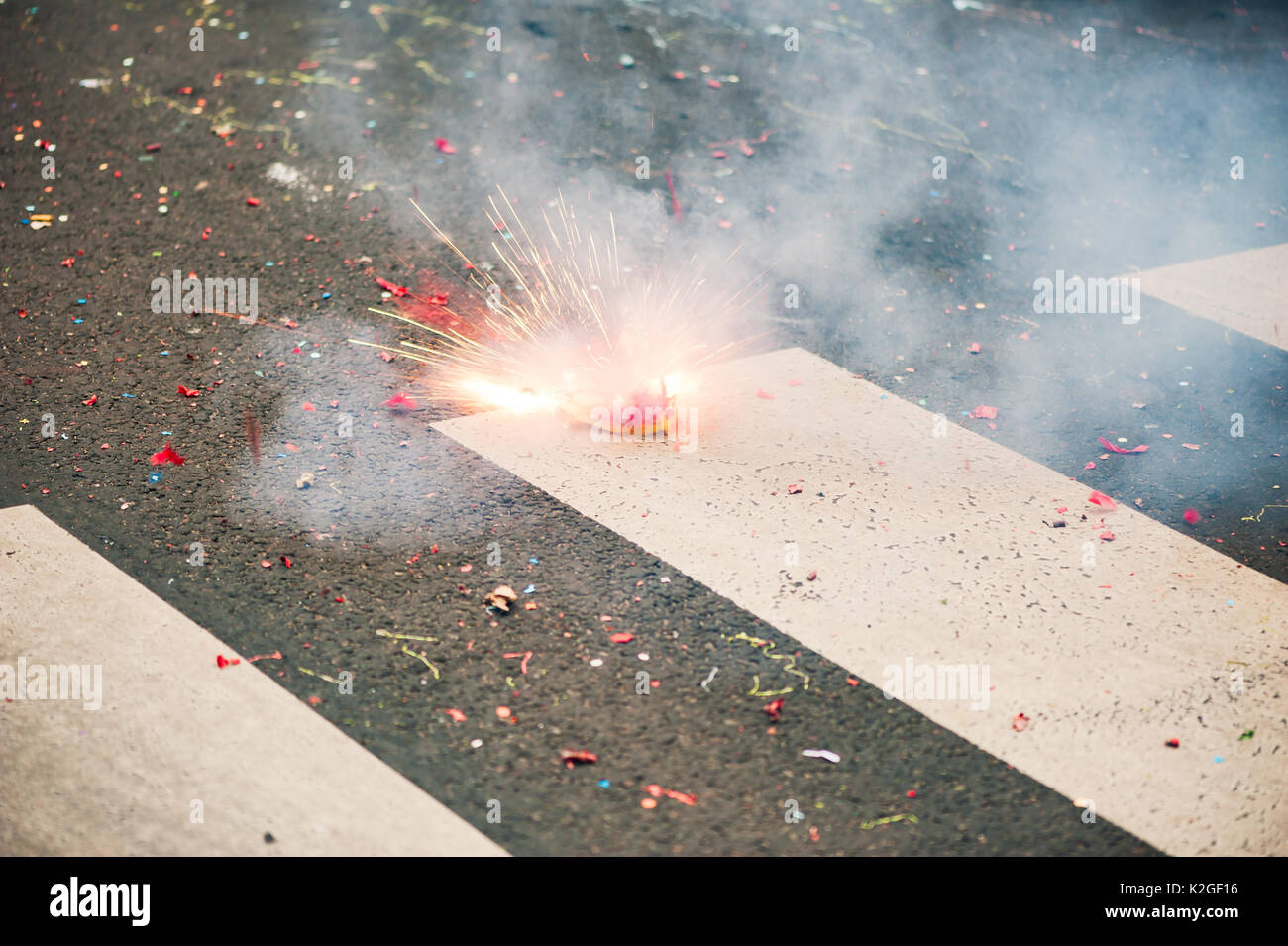 Firecracker exploding on the asphalt of a street Stock Photo - Alamy