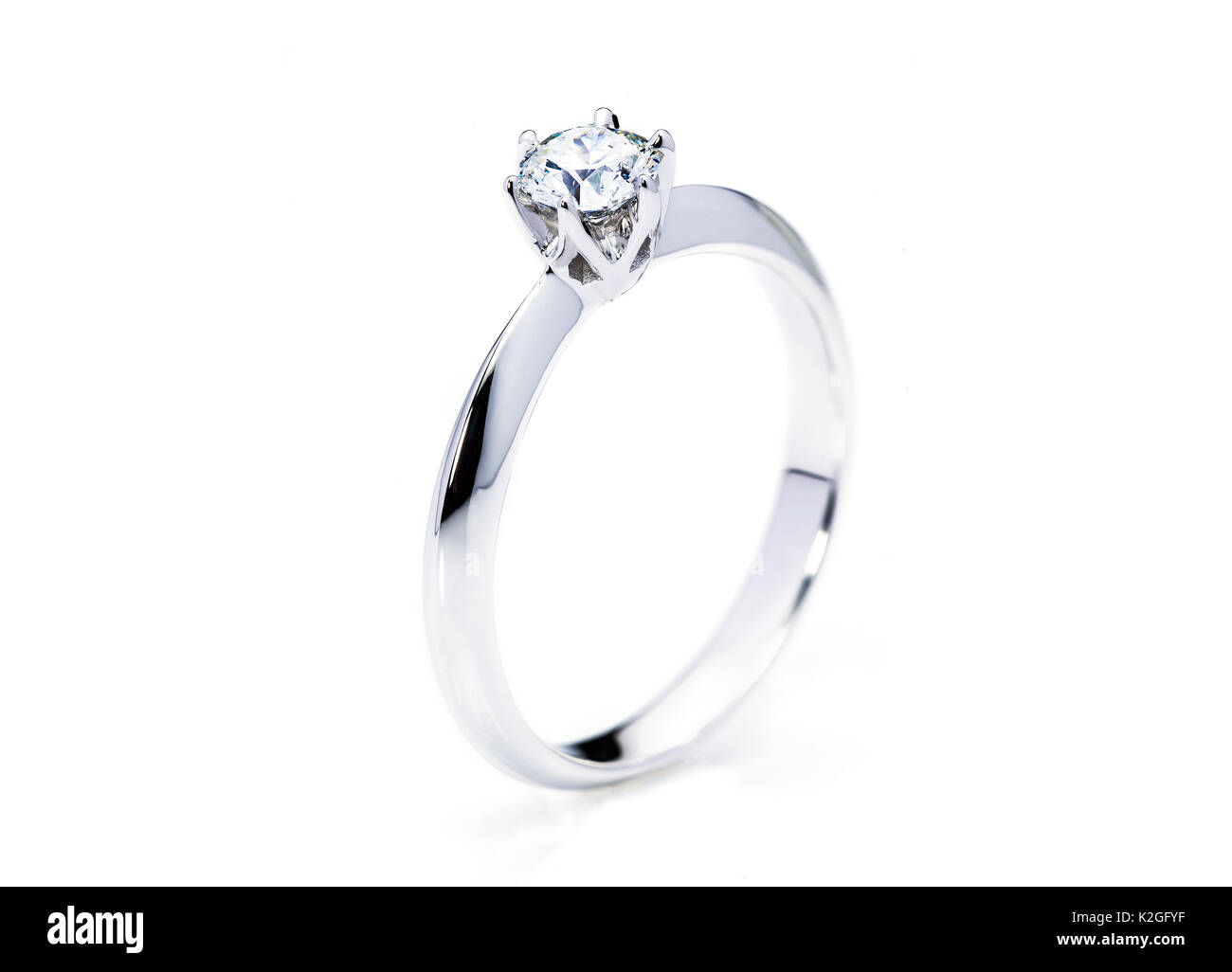 standing up beautiful diamond ring on white background, selective focus ...
