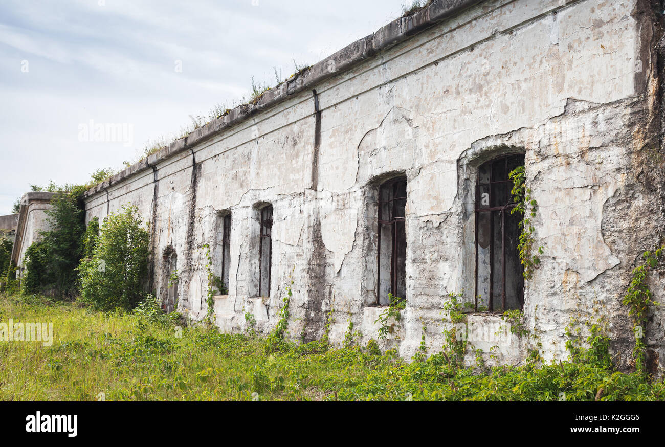 White wall of an old abandoned fortification from WWII period on ...