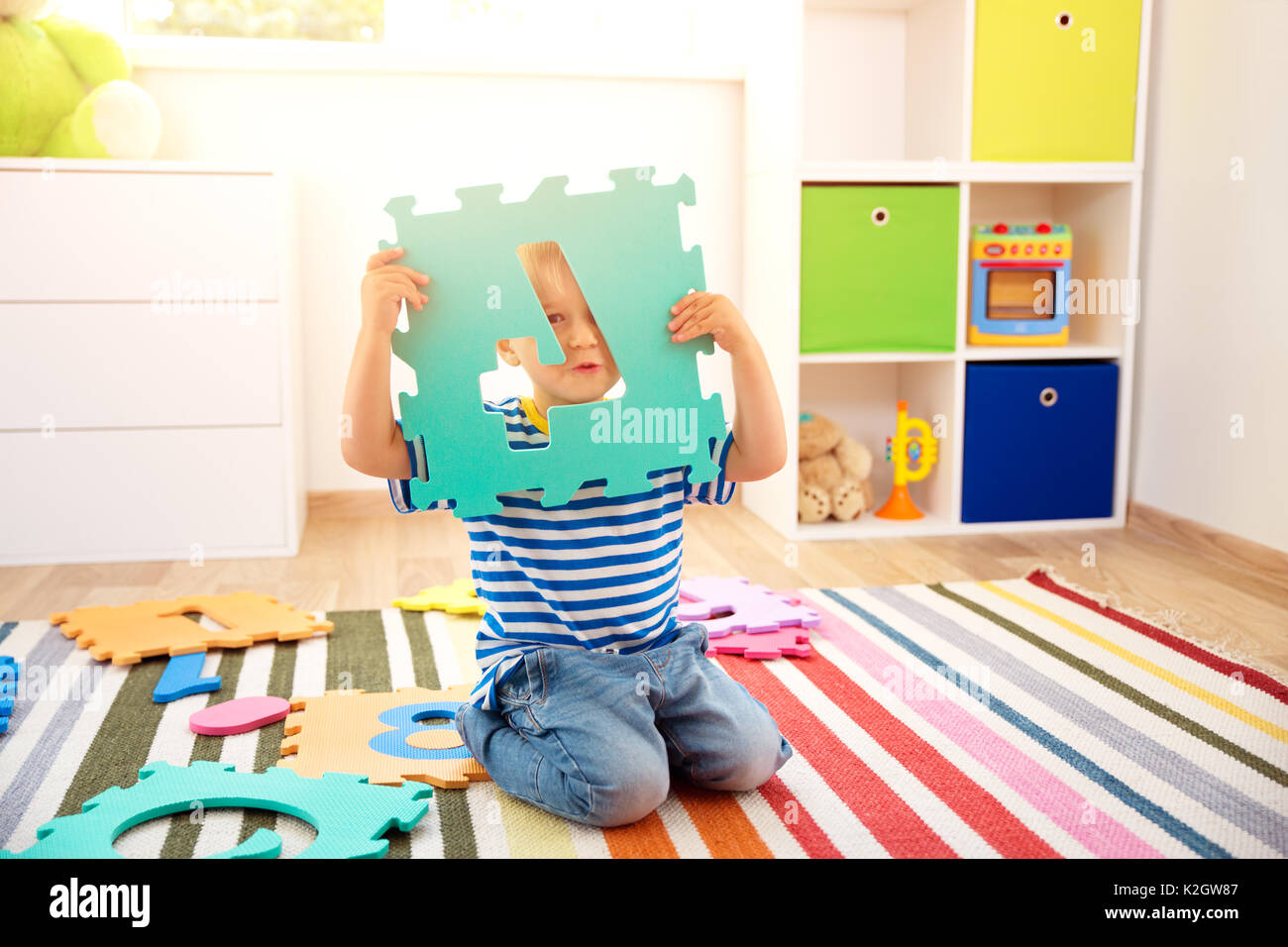 Little child playing with numbers Stock Photo - Alamy