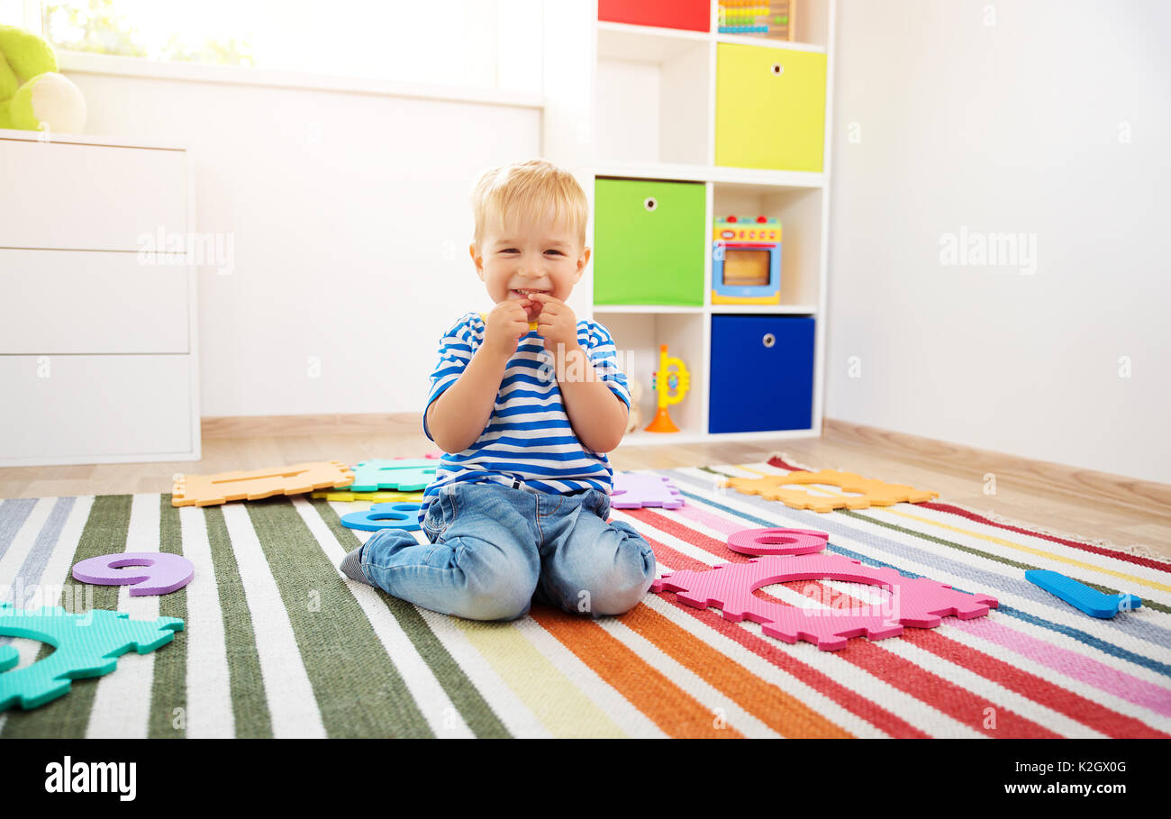 Little child playing with numbers Stock Photo - Alamy