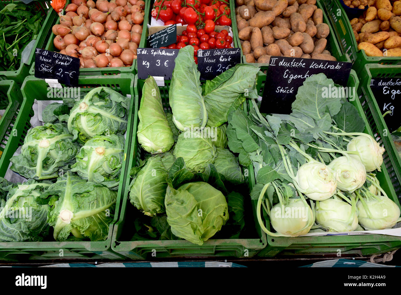 Market stall offering different sorts vegetables from left to right ...